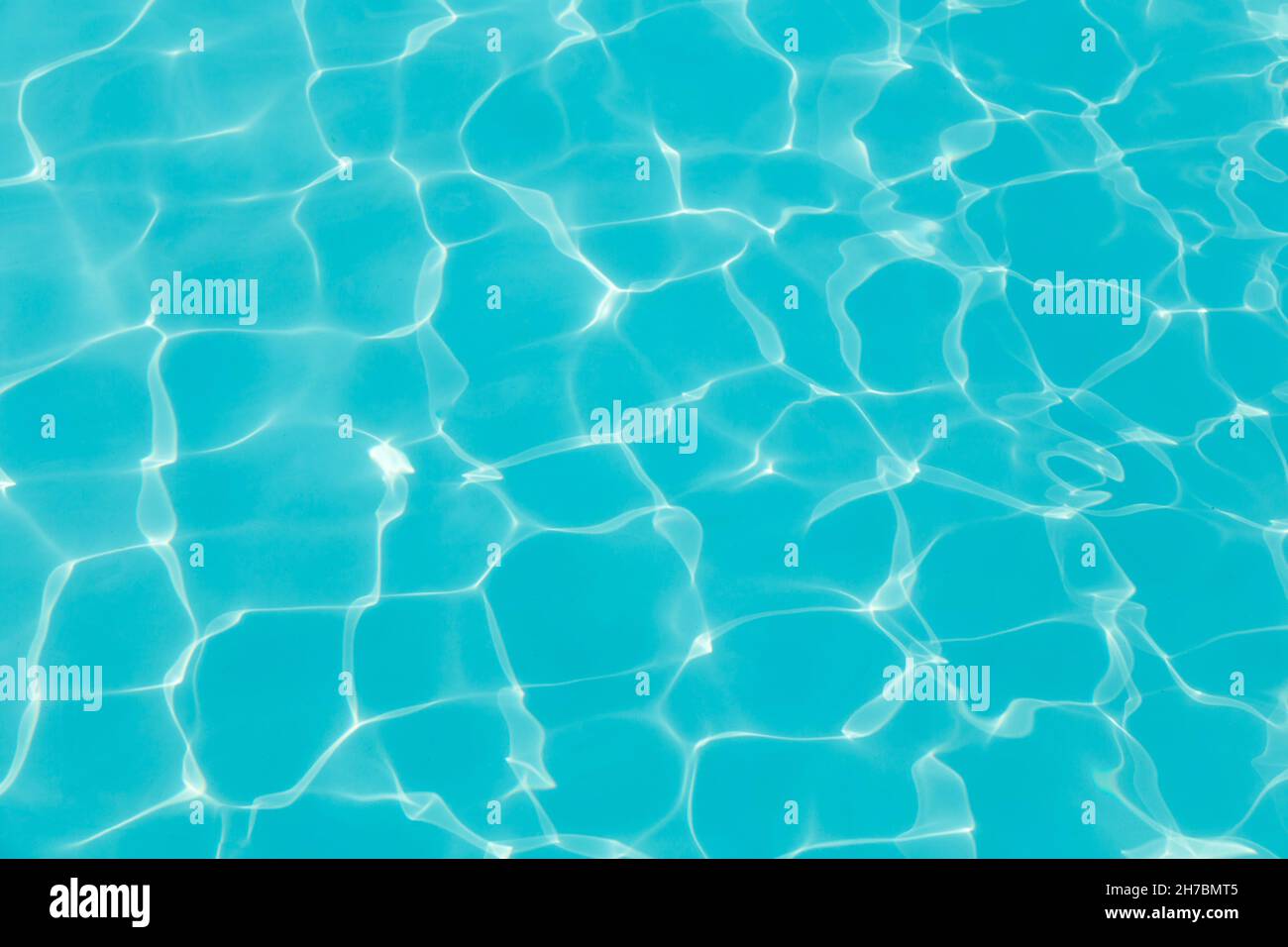 Swimming Pool Surface reflection background Stock Photo - Alamy