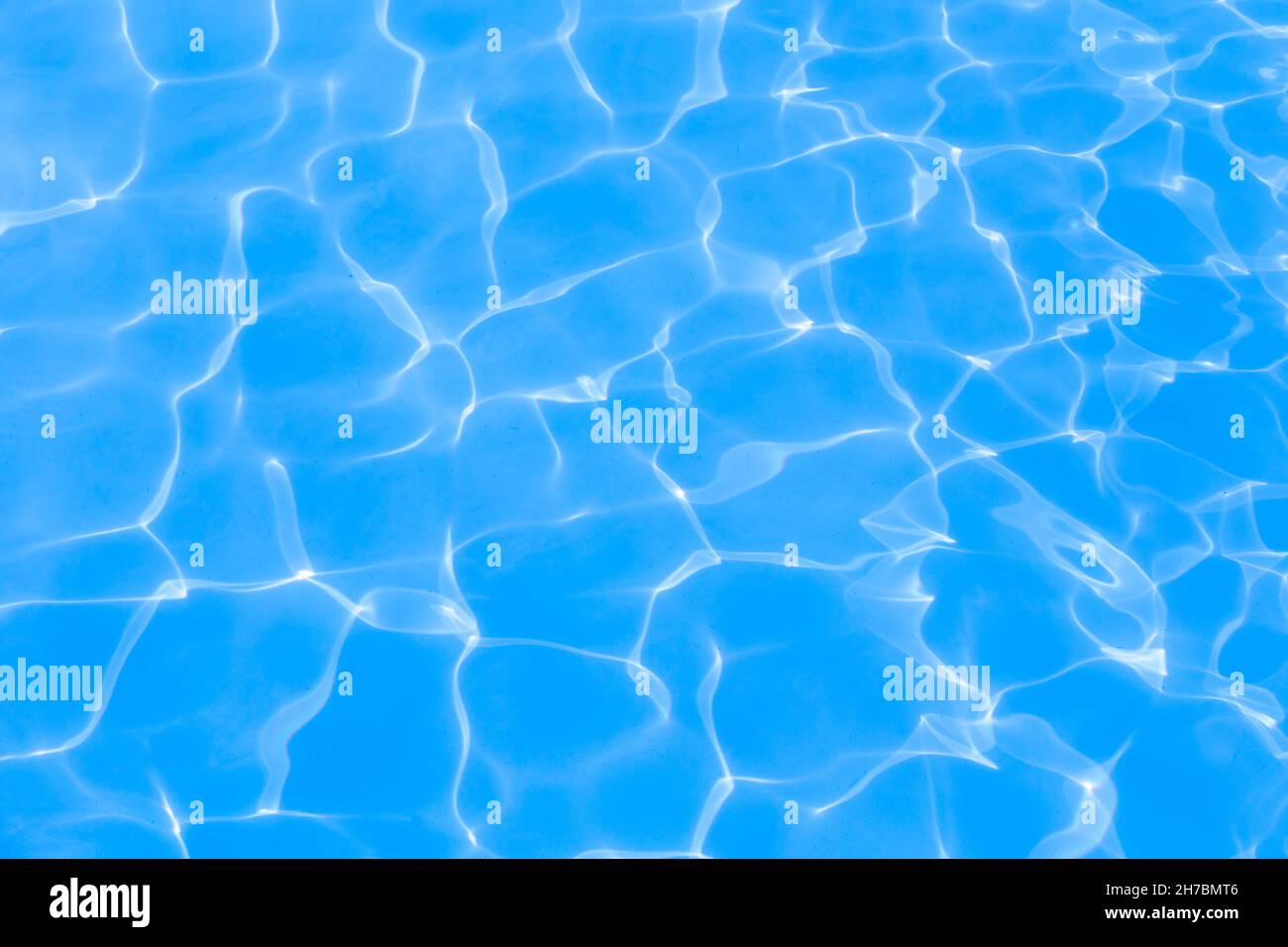 Swimming Pool Surface reflection background Stock Photo - Alamy