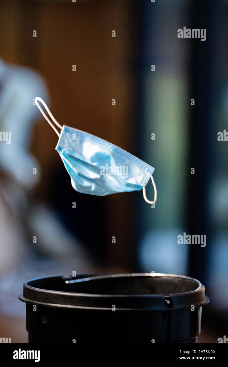 mask in bin, rubbish, garbage and trash. Littering a safety mask in ...