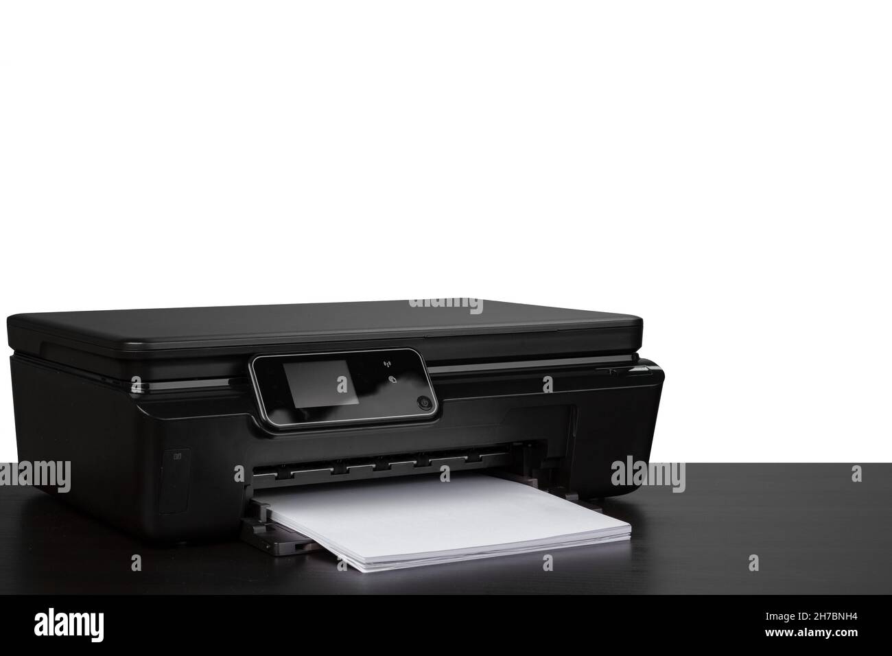 Laser home printer on table against white backgorund Stock Photo - Alamy