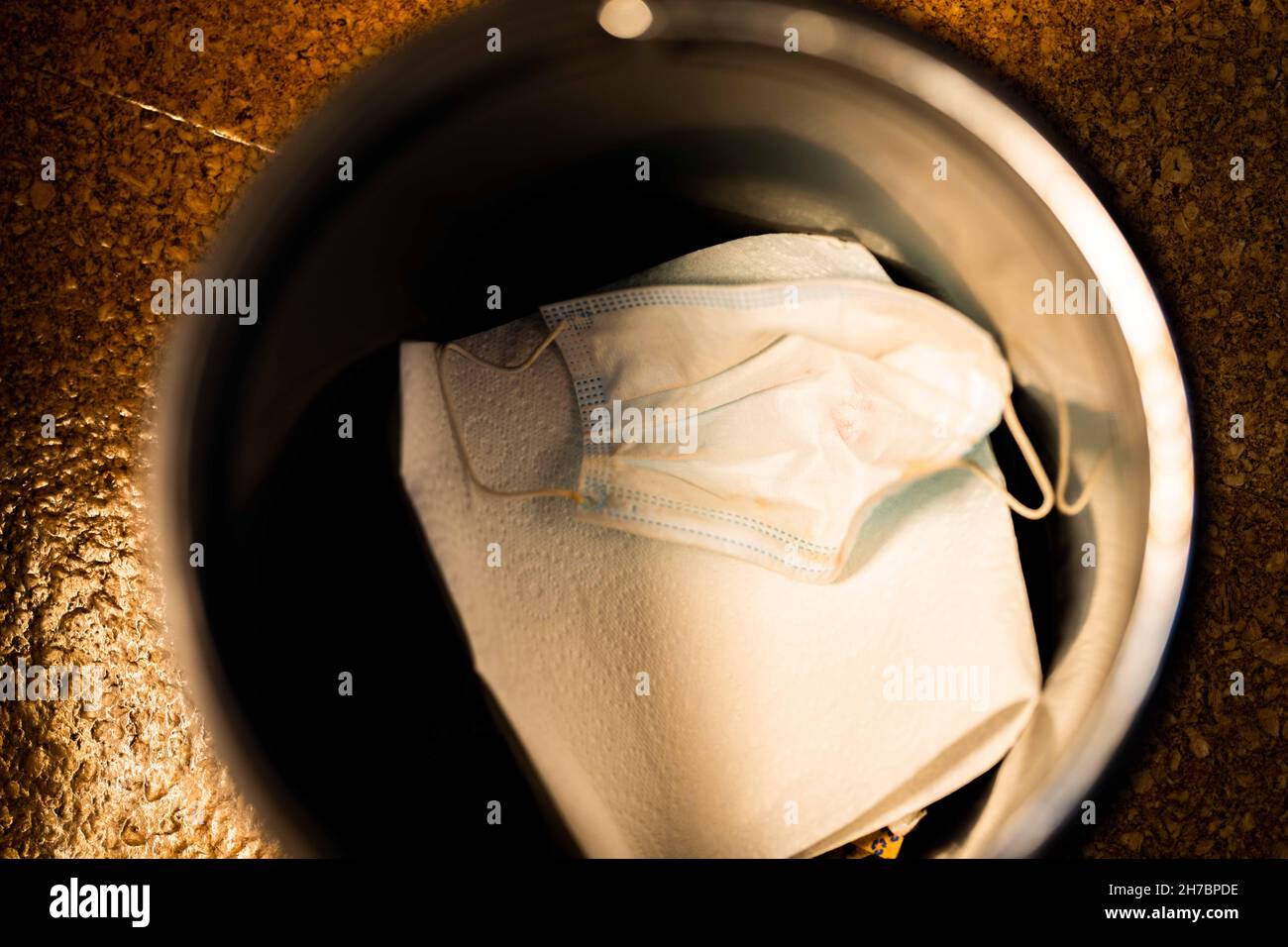 mask in bin, rubbish, garbage and trash. Littering a safety mask in ...