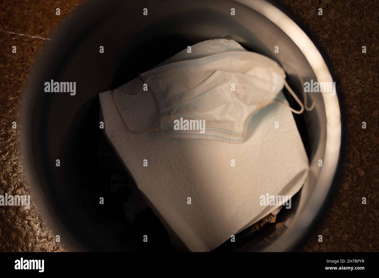 mask in bin, rubbish, garbage and trash. Littering a safety mask in ...