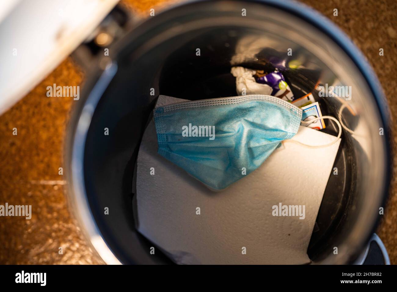 mask in bin, rubbish, garbage and trash. Littering a safety mask in ...