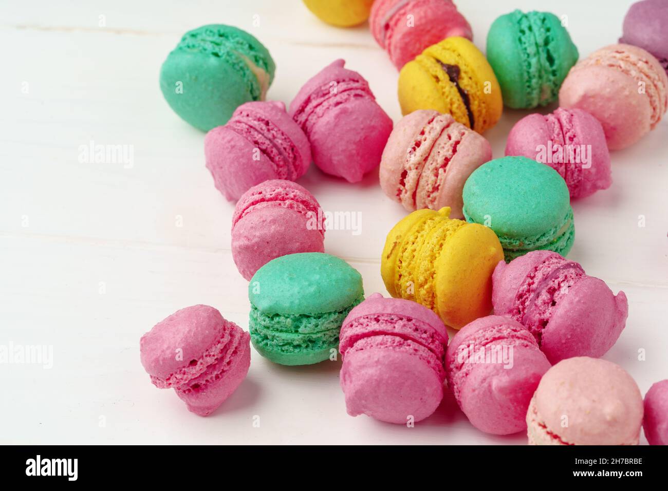 Pile of colorful macarons on white background Stock Photo - Alamy