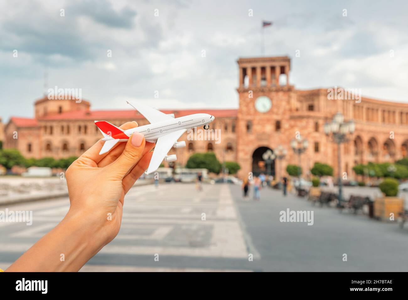 Tourist woman with a toy airplane on the background of a Republic ...