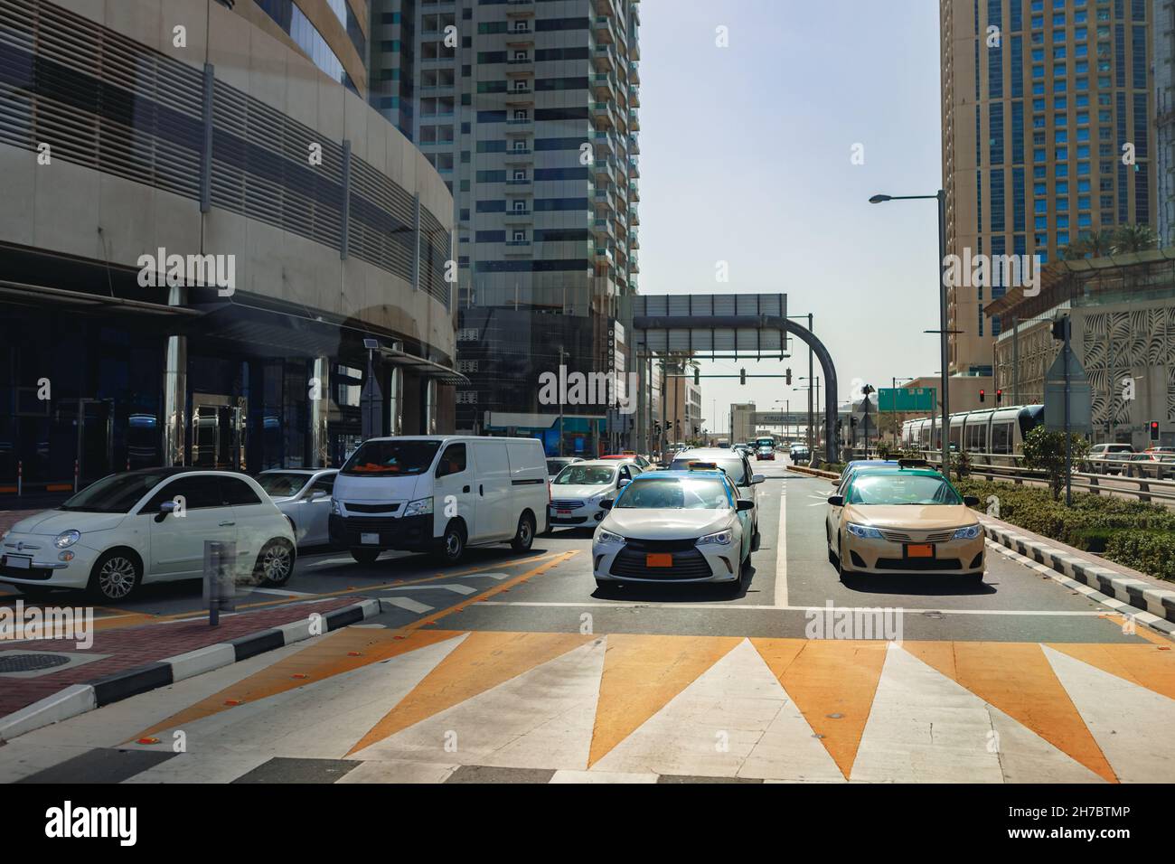 Asphalt road with modern city skyline of Dubai Stock Photo - Alamy