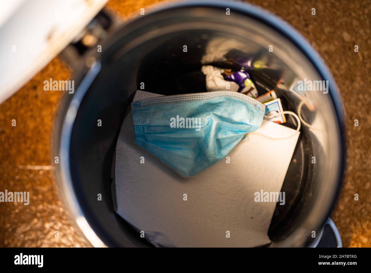 mask in bin, rubbish, garbage and trash. Littering a safety mask in ...