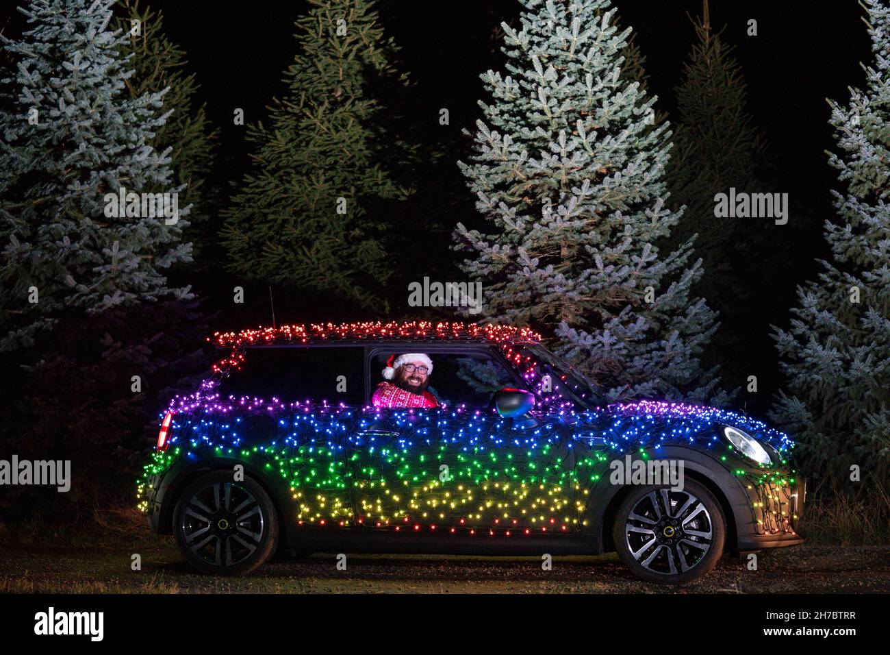 Nico Martin with a Mini Electric wrapped in thousands of Christmas ...