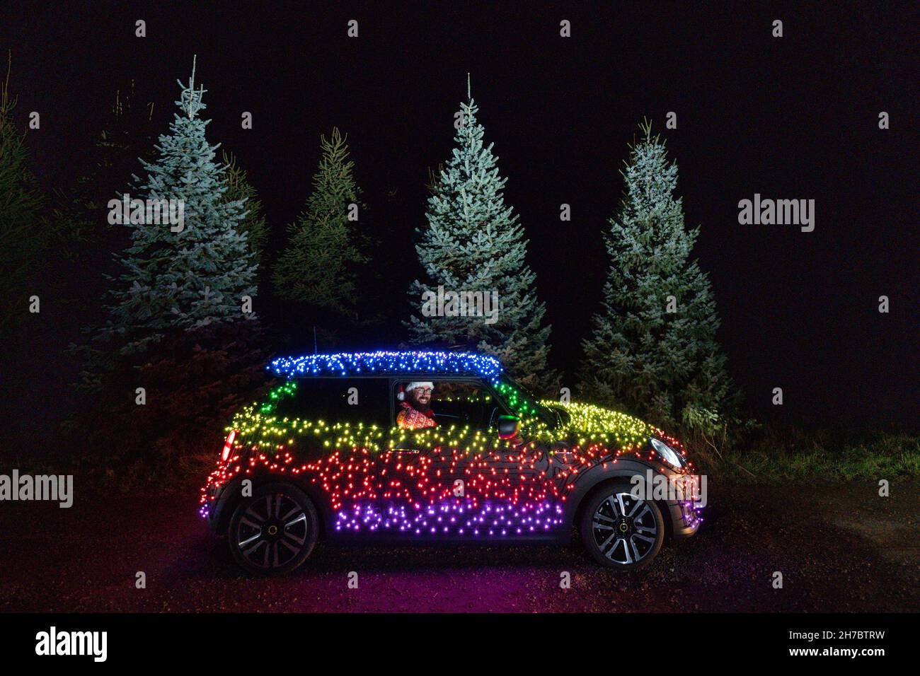 Nico Martin with a Mini Electric wrapped in thousands of Christmas ...