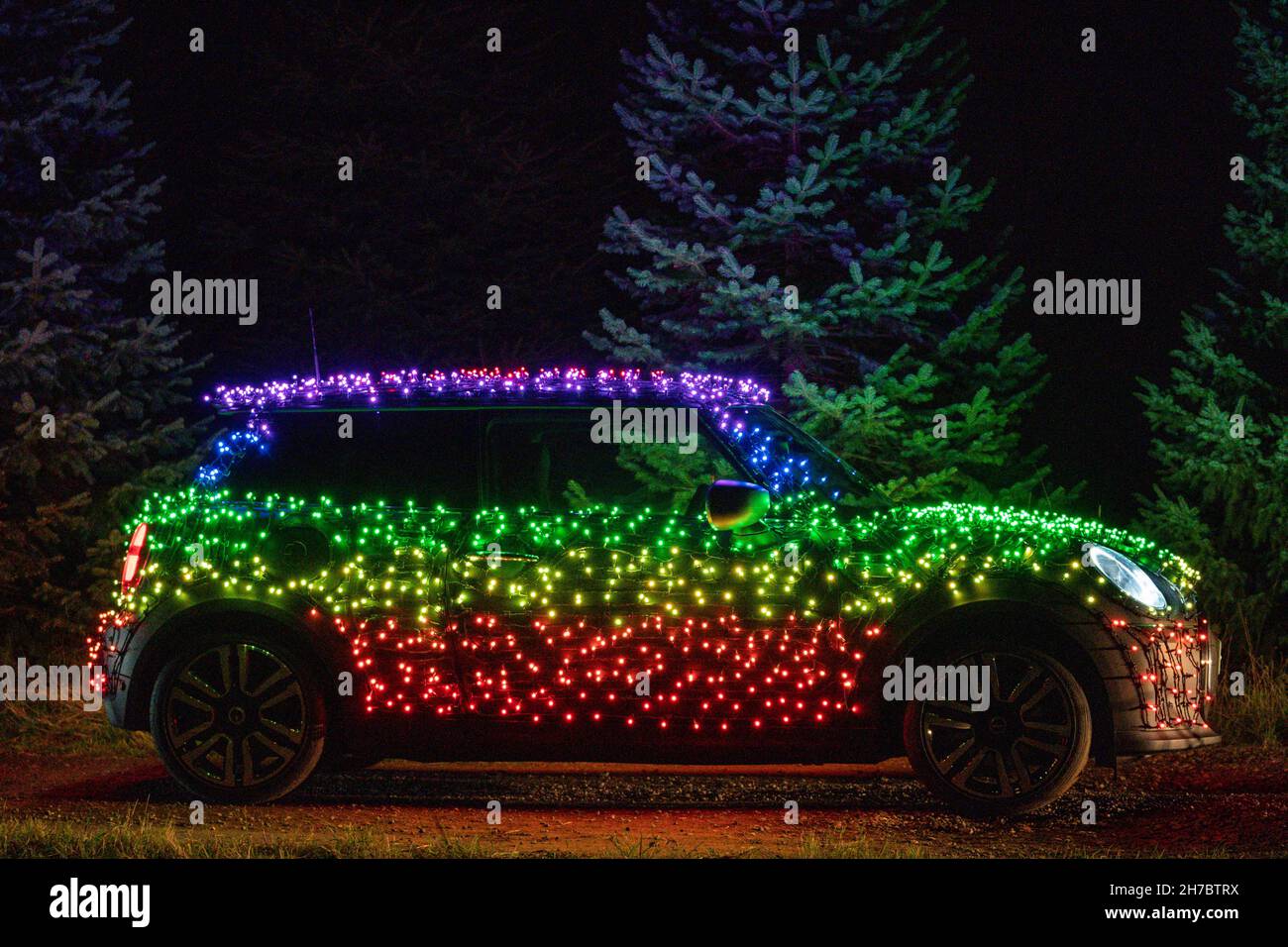 A Mini Electric wrapped in thousands of Christmas fairy lights, at ...