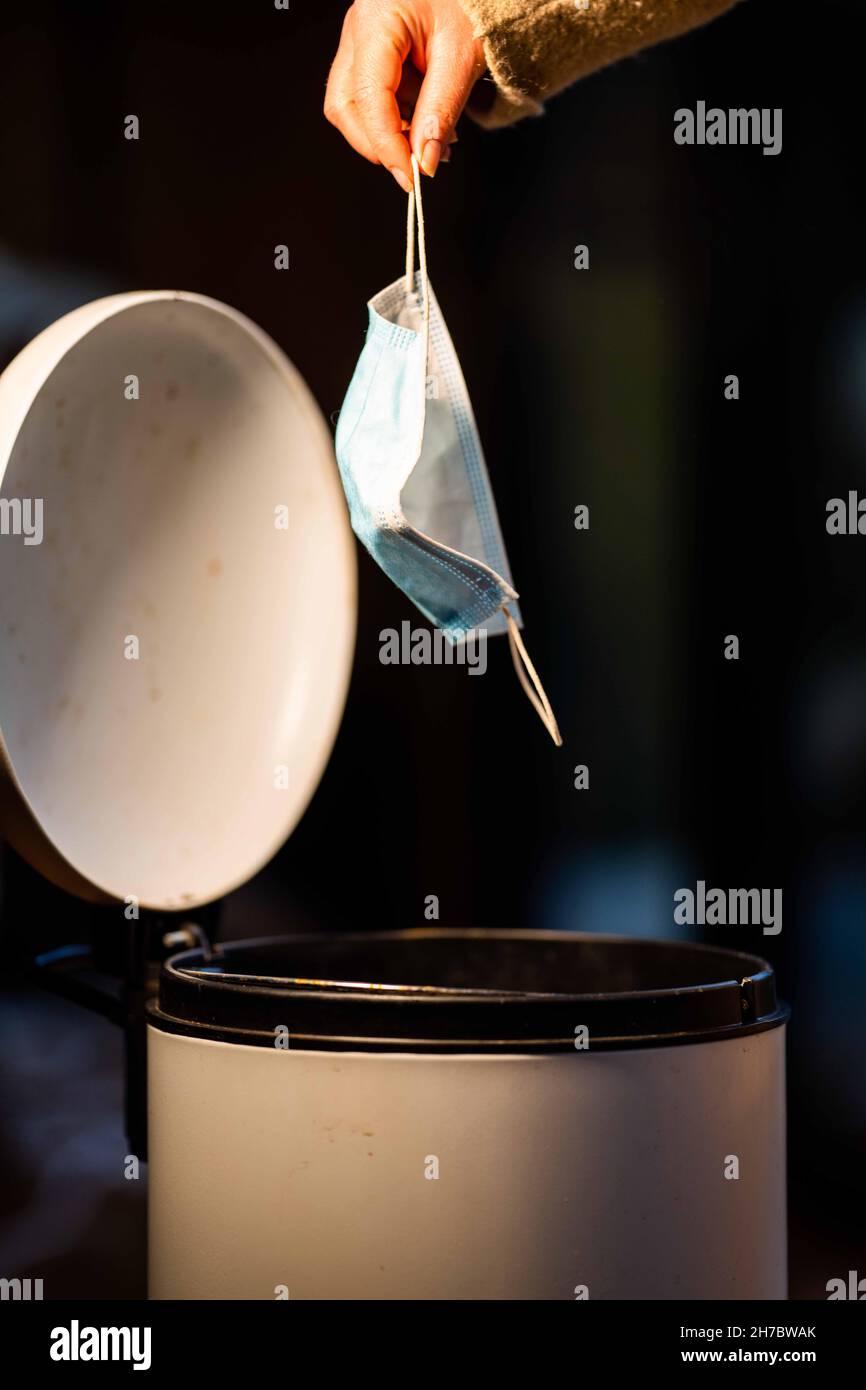 mask in bin, rubbish, garbage and trash. Littering a safety mask in ...