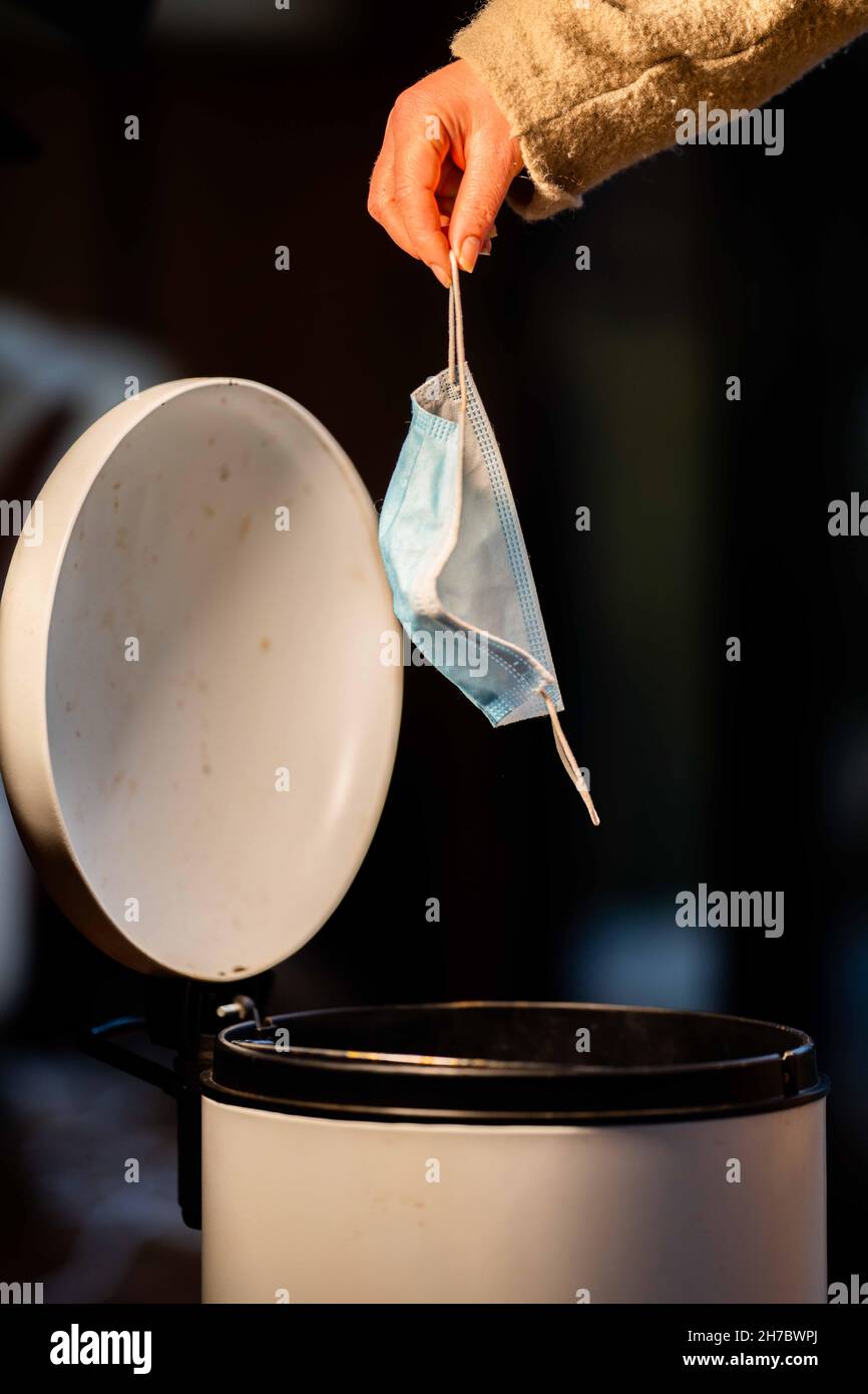 mask in bin, rubbish, garbage and trash. Littering a safety mask in ...