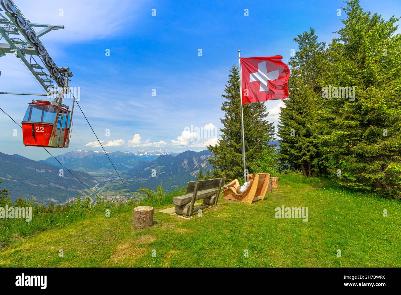 Woman in Brambruesch in Switzerland. Swiss cable car of Chur city with ...