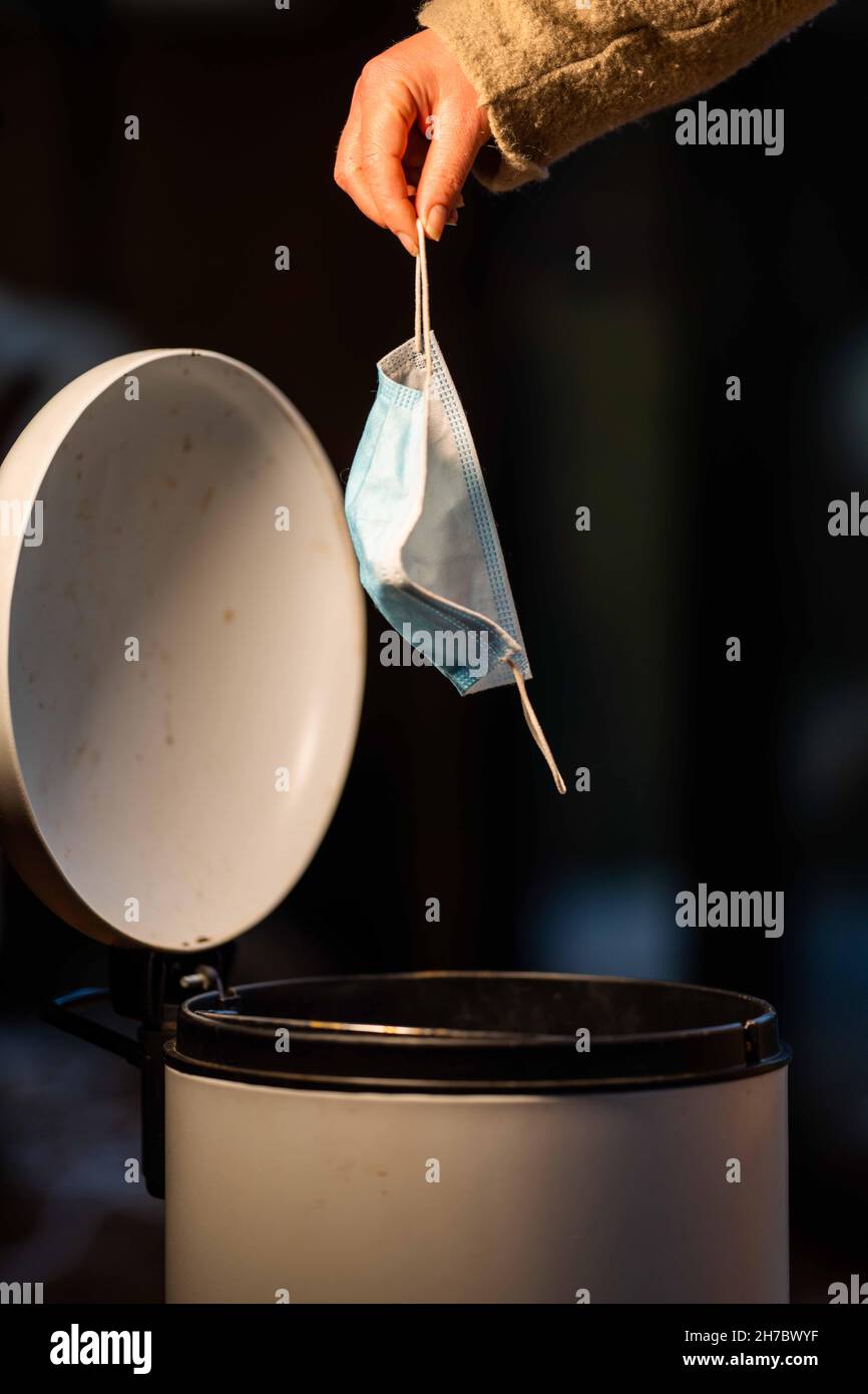 mask in bin, rubbish, garbage and trash. Littering a safety mask in ...