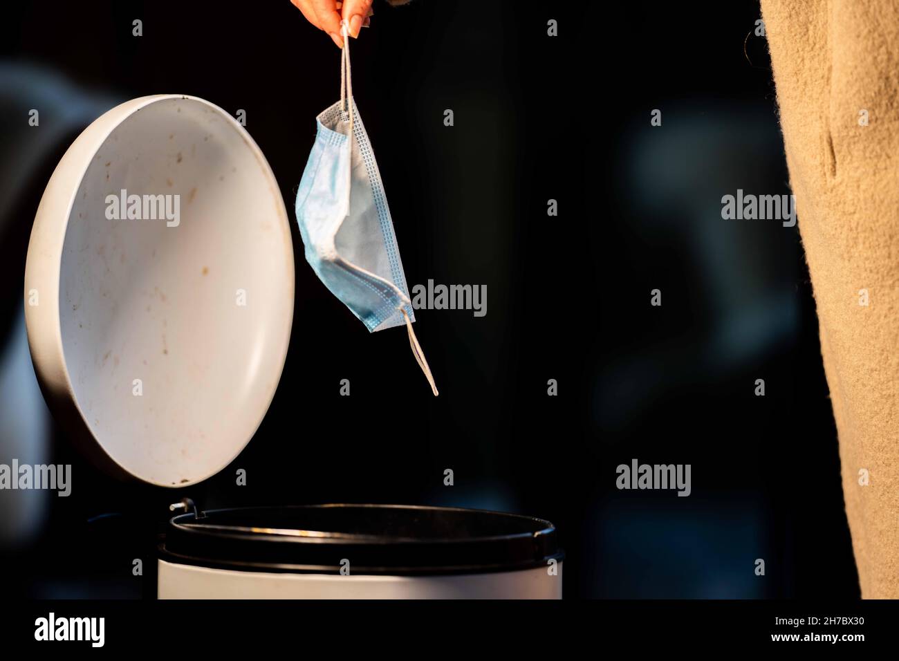 mask in bin, rubbish, garbage and trash. Littering a safety mask in ...