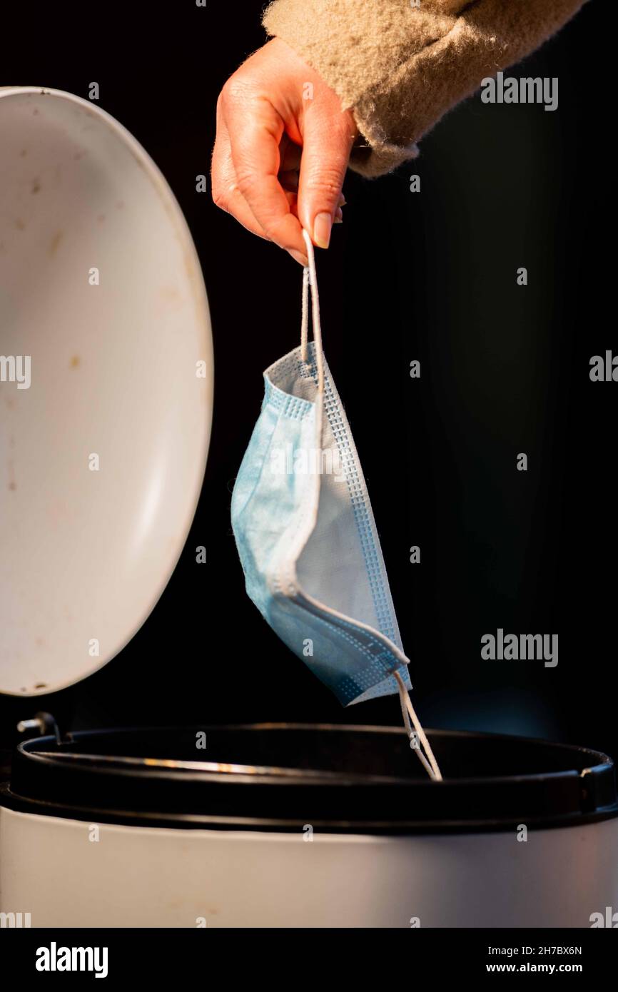 mask in bin, rubbish, garbage and trash. Littering a safety mask in ...