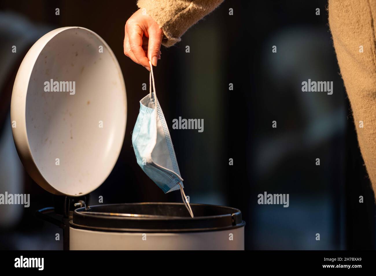 mask in bin, rubbish, garbage and trash. Littering a safety mask in ...