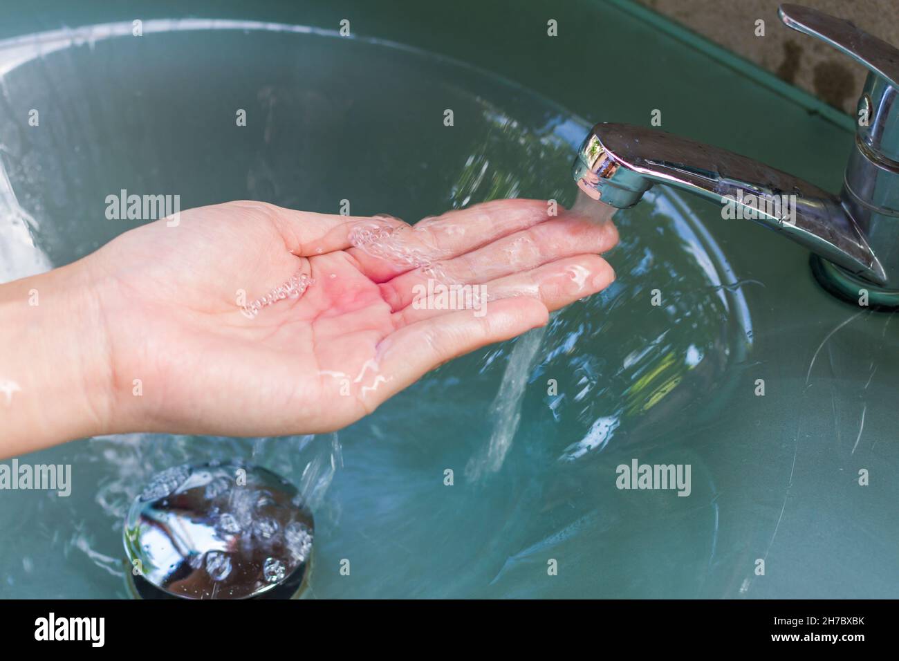 girl washing her hand out door Stock Photo - Alamy