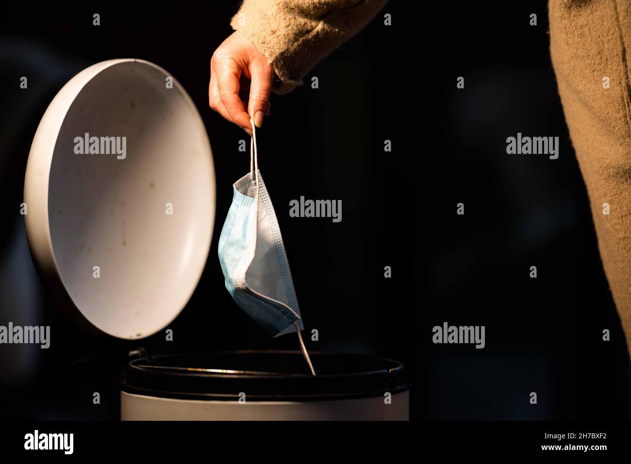 mask in bin, rubbish, garbage and trash. Littering a safety mask in ...