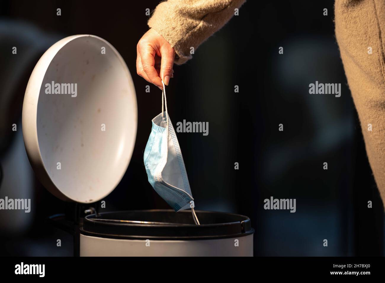mask in bin, rubbish, garbage and trash. Littering a safety mask in ...