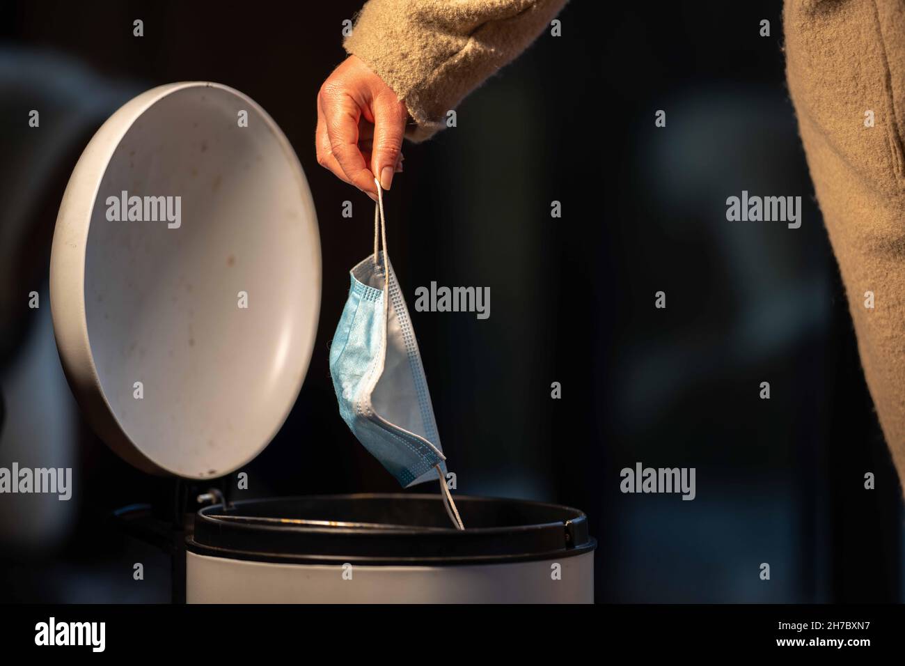 mask in bin, rubbish, garbage and trash. Littering a safety mask in ...