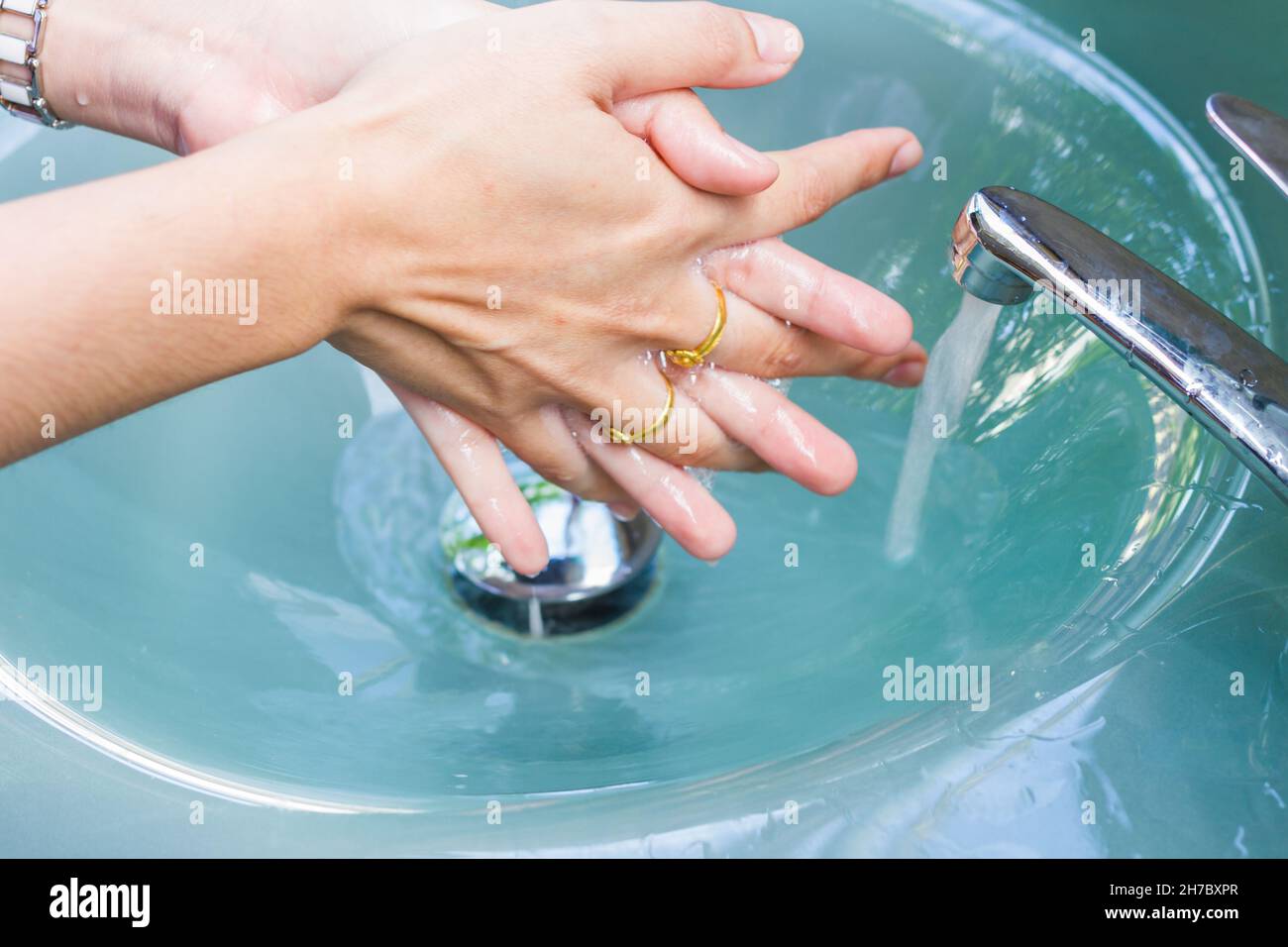 girl washing her hand out door Stock Photo - Alamy