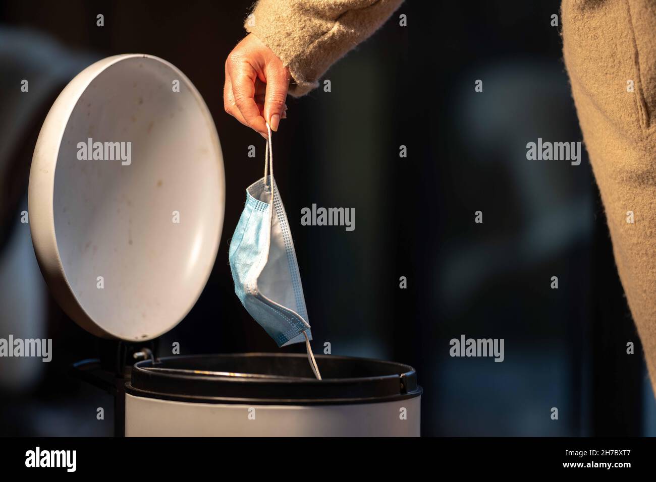 mask in bin, rubbish, garbage and trash. Littering a safety mask in ...