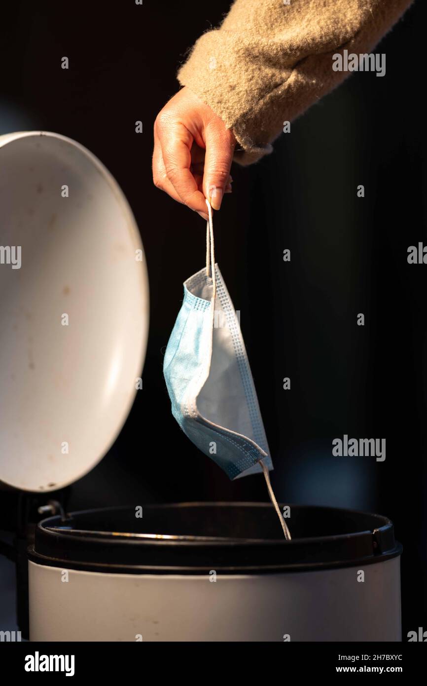 mask in bin, rubbish, garbage and trash. Littering a safety mask in ...