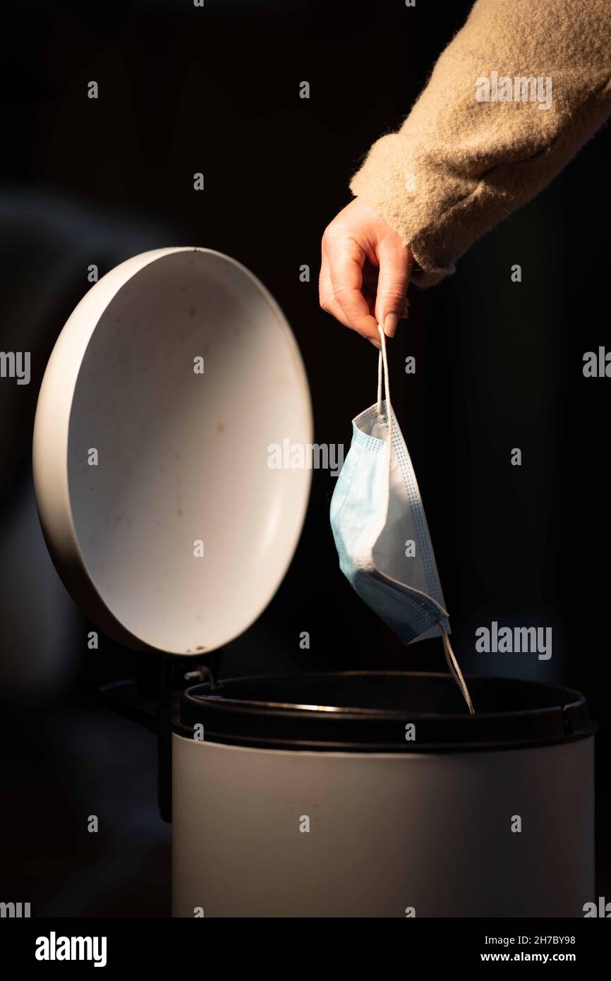 mask in bin, rubbish, garbage and trash. Littering a safety mask in ...