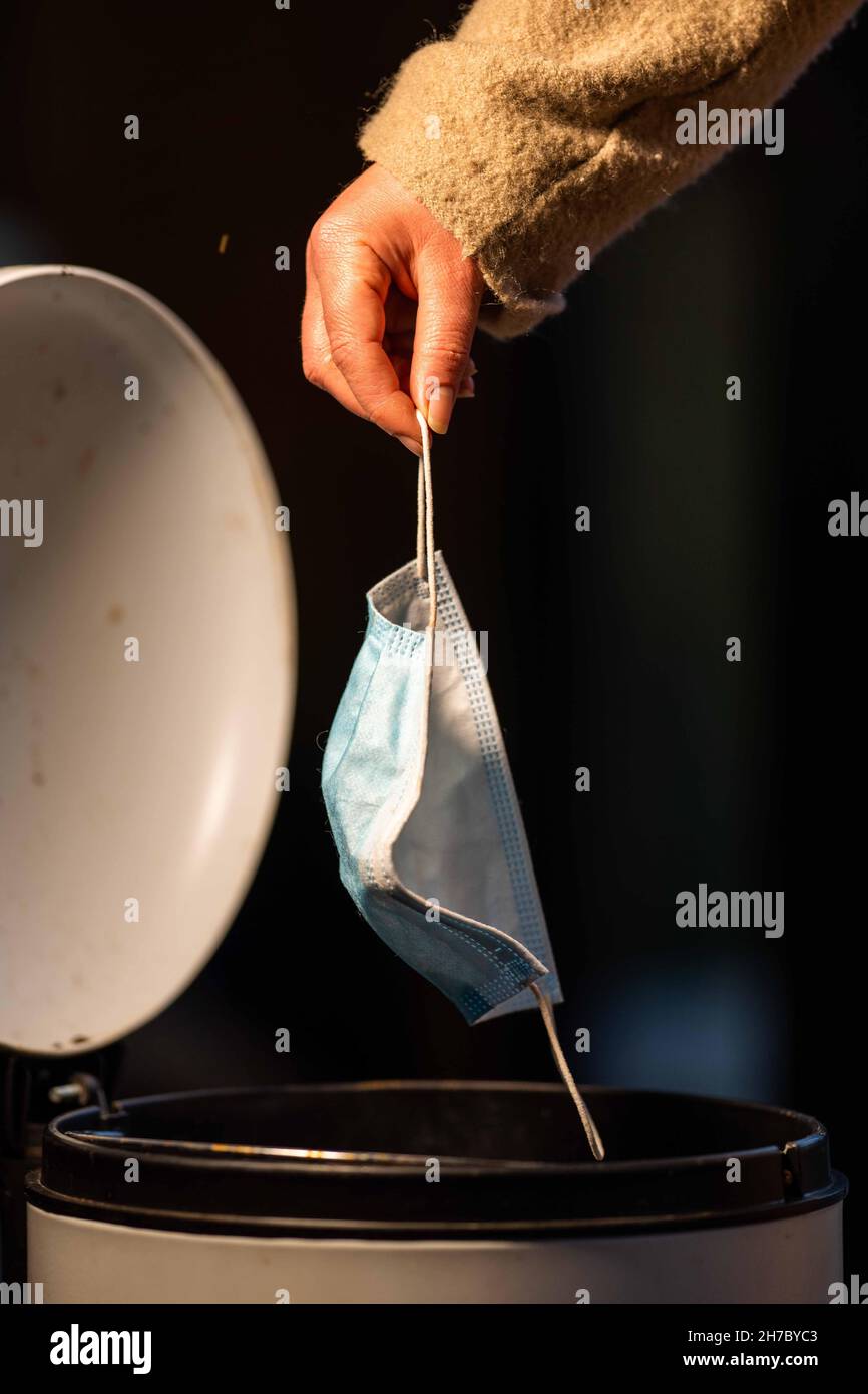 mask in bin, rubbish, garbage and trash. Littering a safety mask in ...