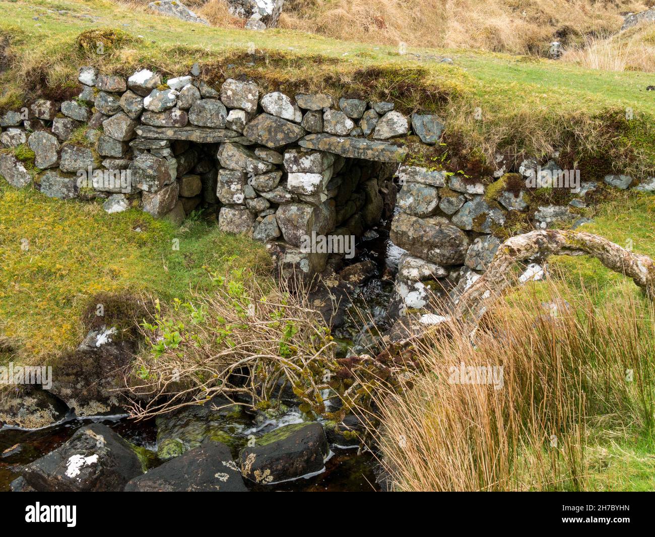 Small stone slab (Clapper) bridge over small burn, Isle of Harris ...