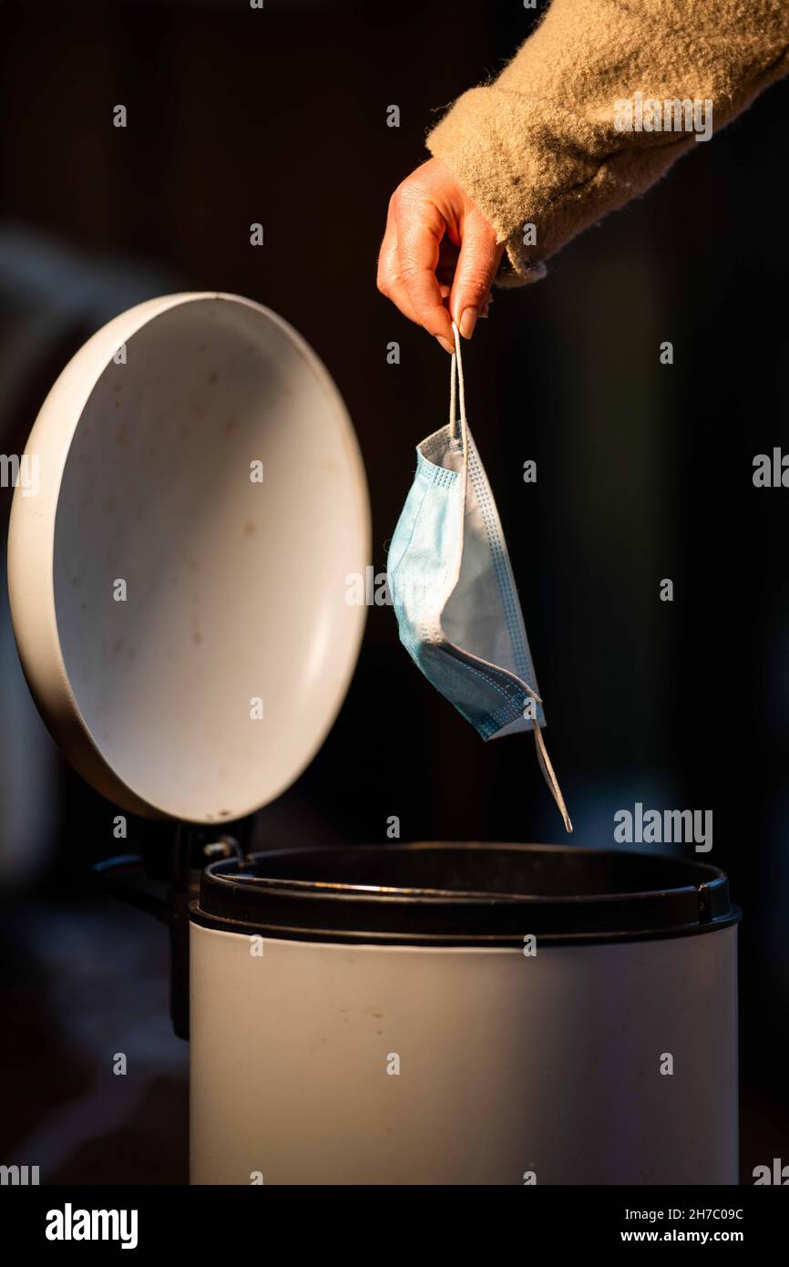 mask in bin, rubbish, garbage and trash. Littering a safety mask in ...