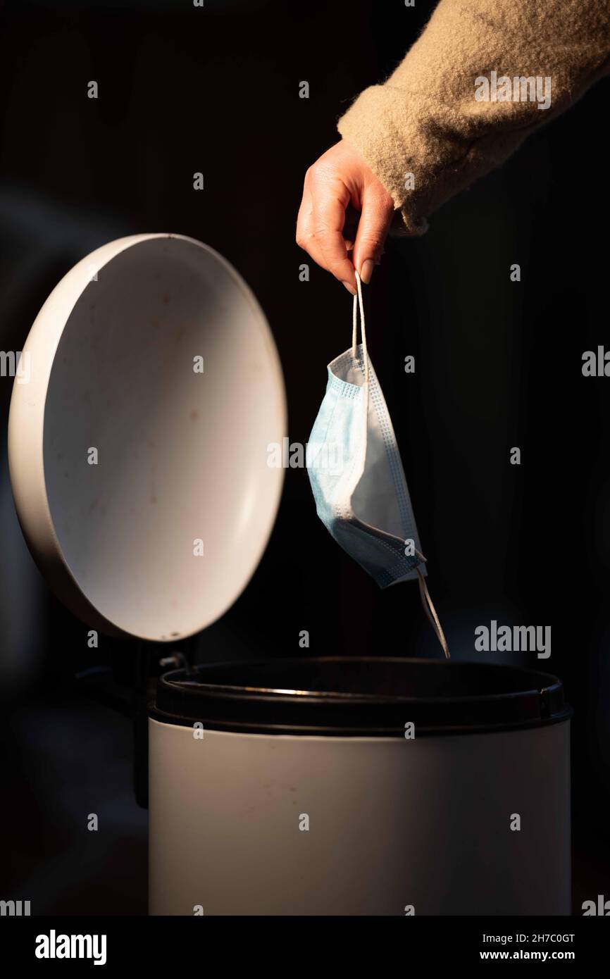 mask in bin, rubbish, garbage and trash. Littering a safety mask in ...