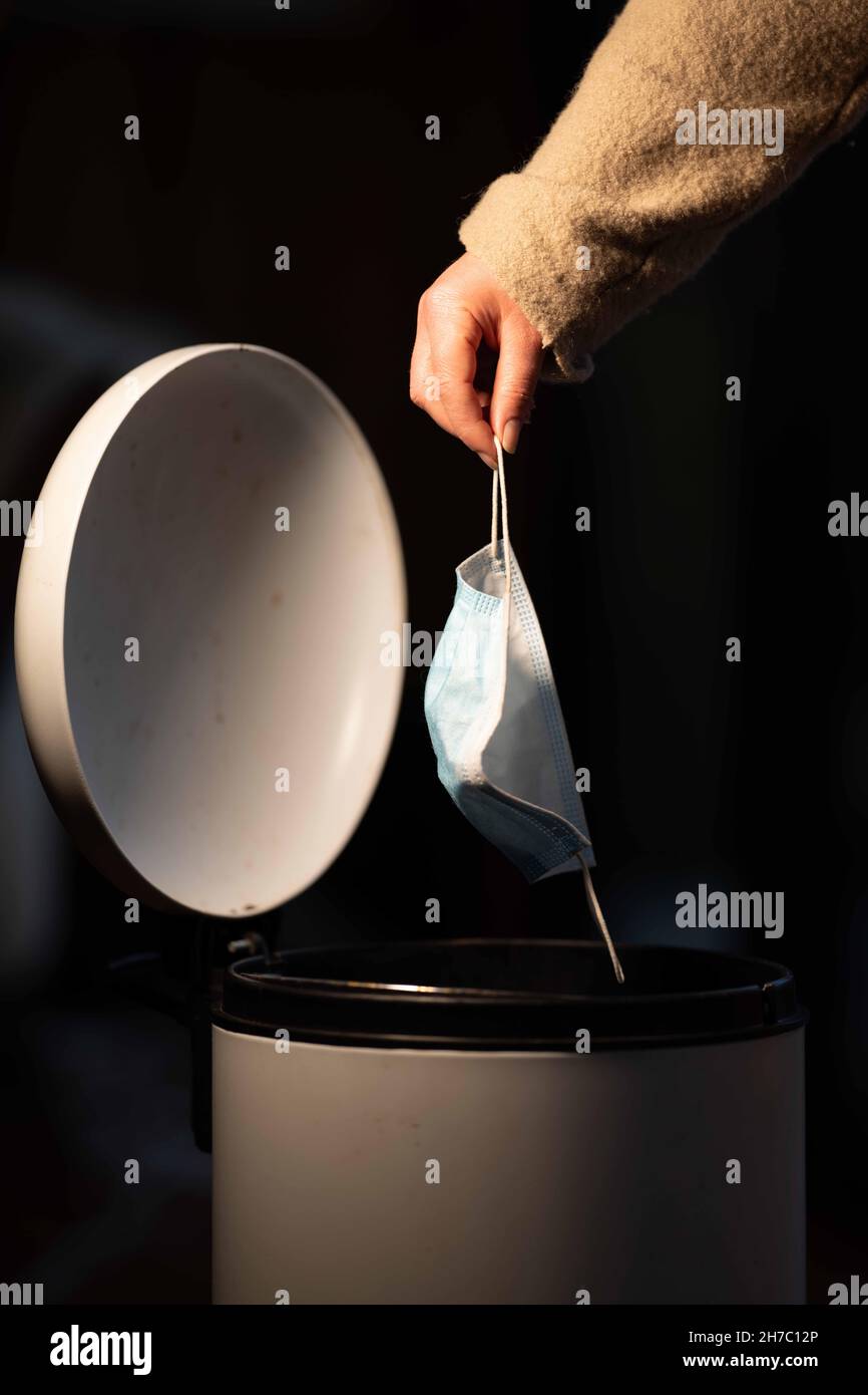 mask in bin, rubbish, garbage and trash. Littering a safety mask in ...