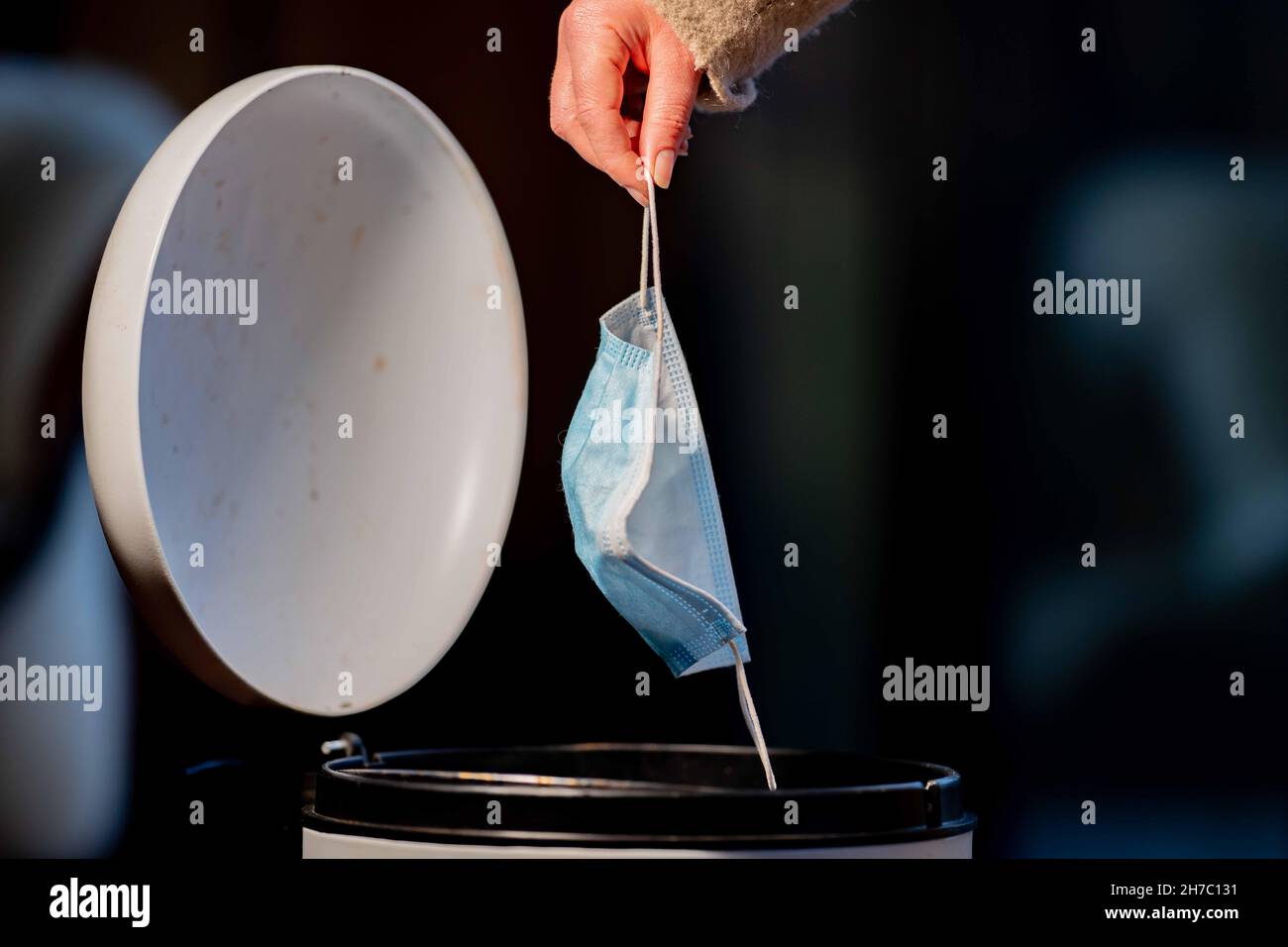 mask in bin, rubbish, garbage and trash. Littering a safety mask in ...
