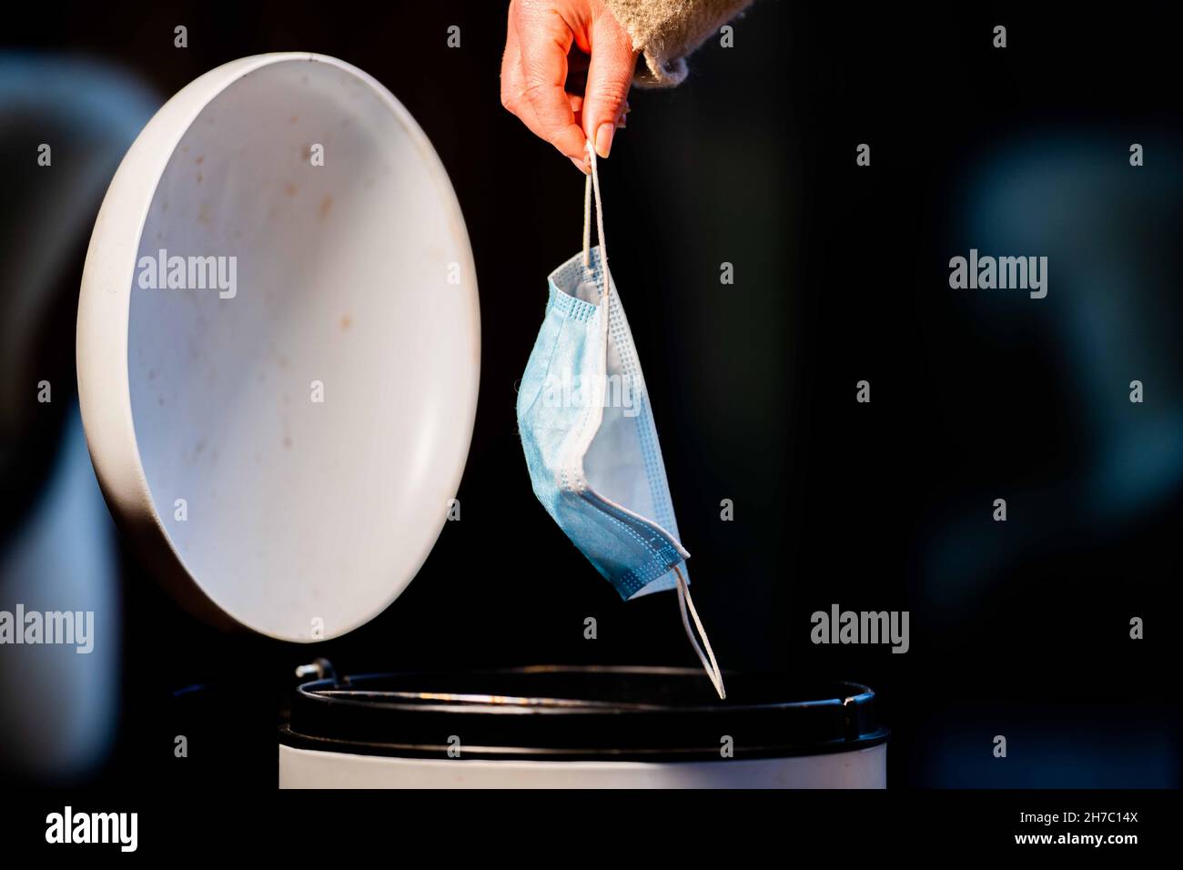 mask in bin, rubbish, garbage and trash. Littering a safety mask in ...