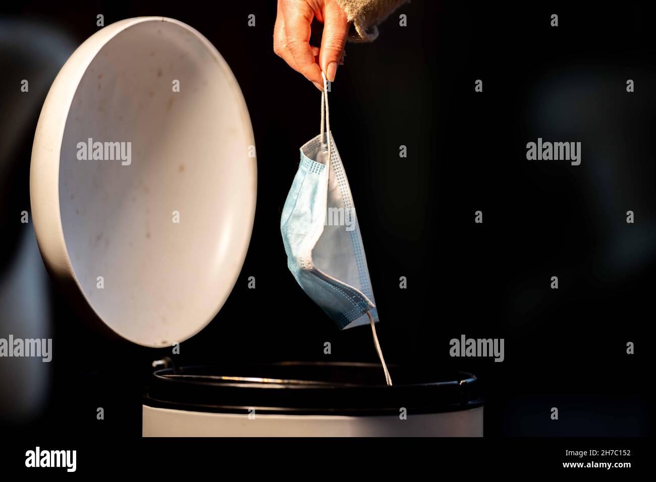 mask in bin, rubbish, garbage and trash. Littering a safety mask in ...
