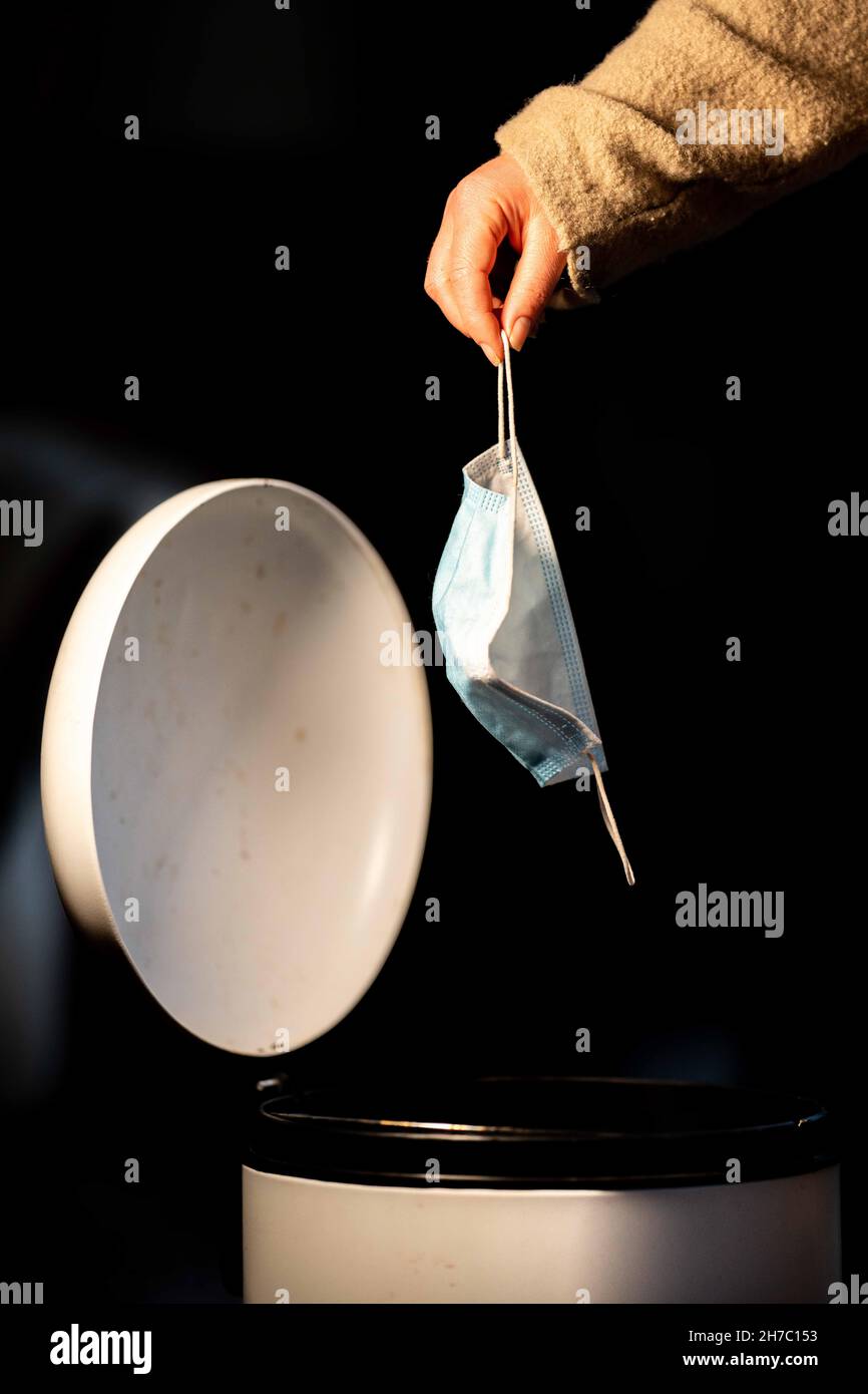 mask in bin, rubbish, garbage and trash. Littering a safety mask in ...