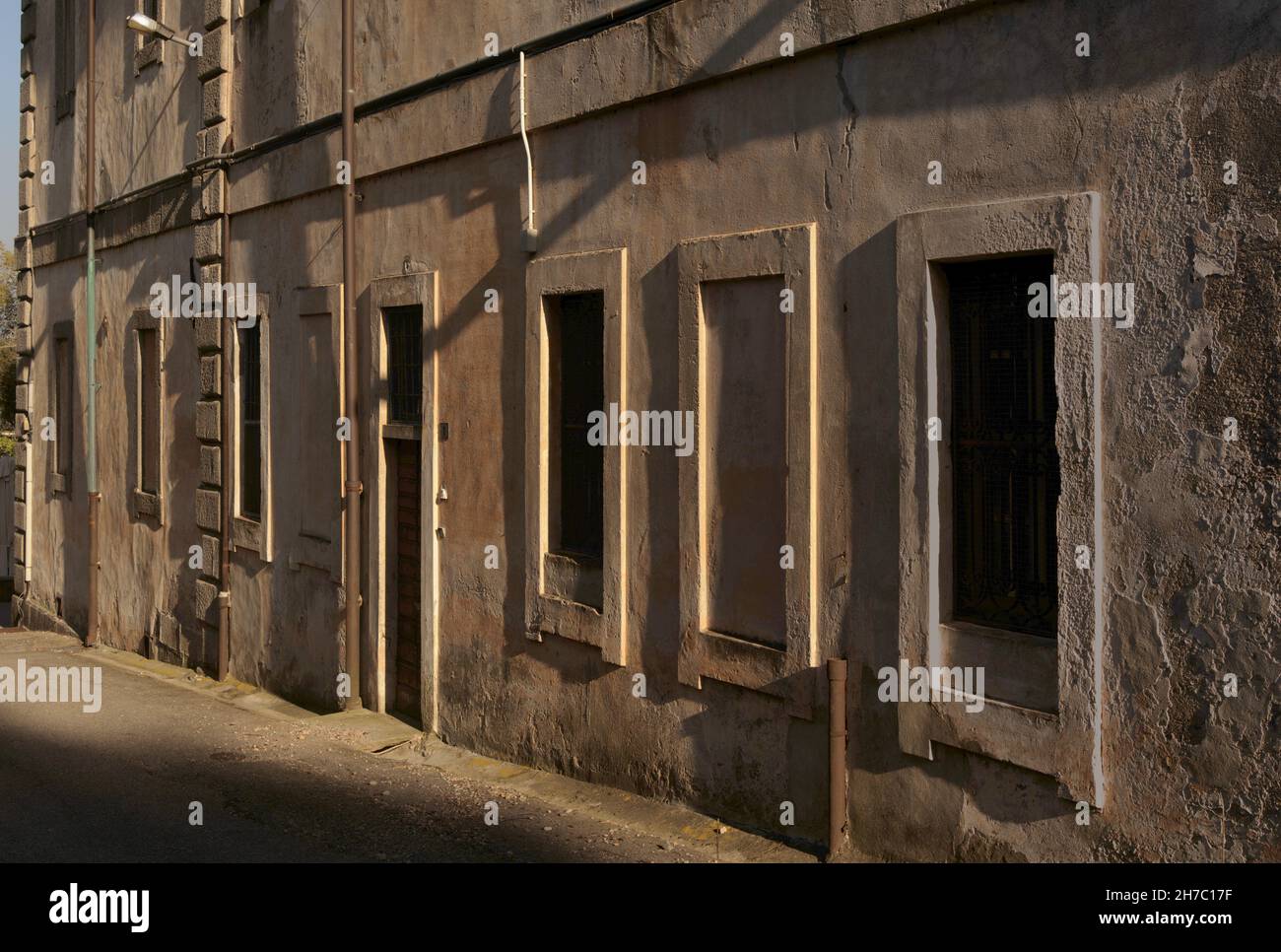 Doors and windows of buiding in Arona in oblique light Stock Photo - Alamy