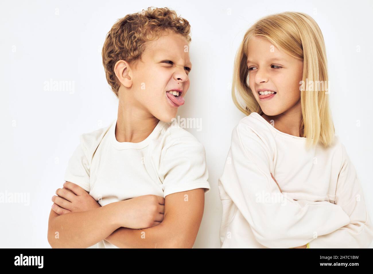 Two preschool children boy and girl quarrel resentment isolated ...