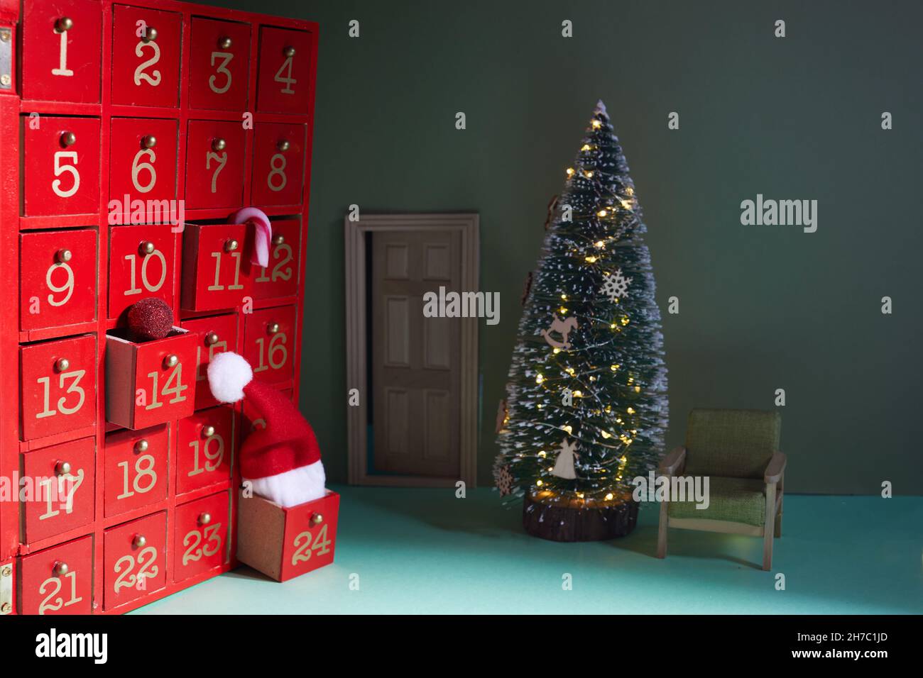Red Christmas Advent Calendar with Santa Claus hat Stock Photo - Alamy