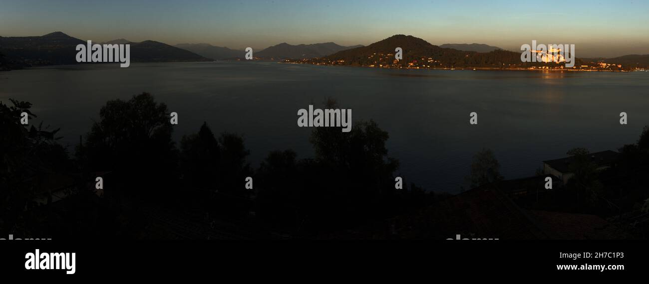 View across Lago Maggiore from Arona showing the Rocca di Angera castle ...