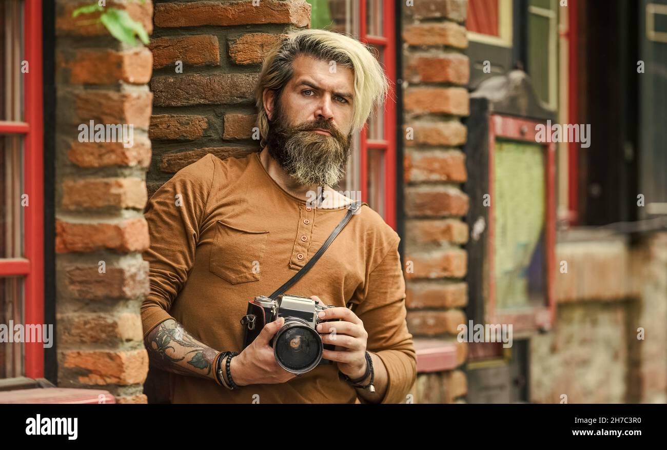 ready to shoot. mature skilled camera man. paparazzi use digital camera ...