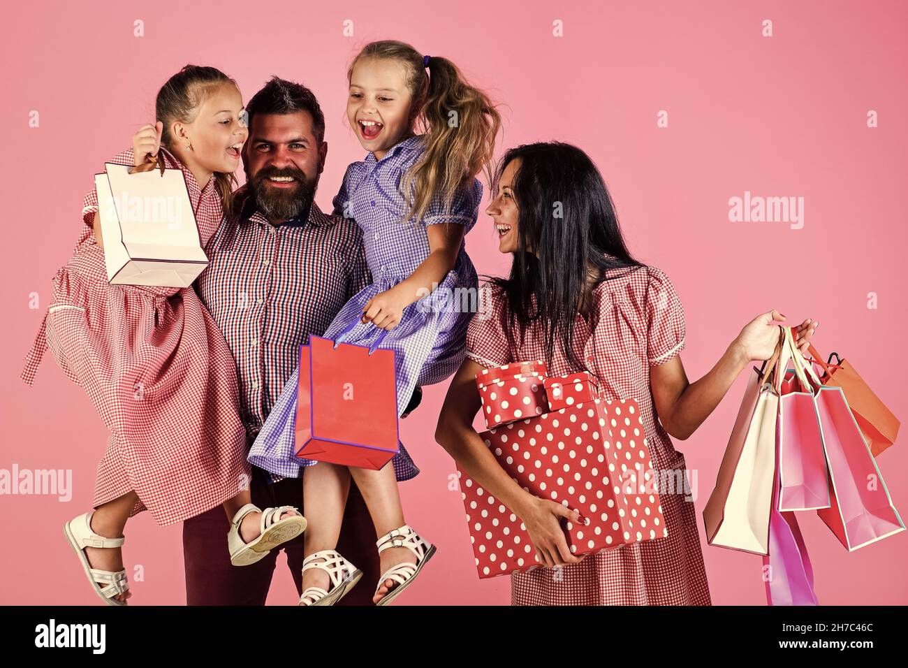 Parents children holding shopping bags hi-res stock photography and ...