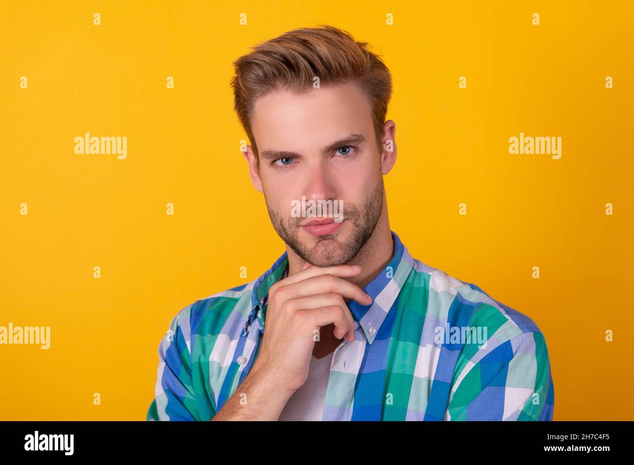 Portrait of serious handsome guy think with thoughtful face yellow ...