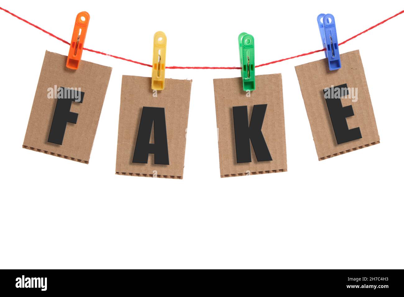 Inscription fake, black letters hung on clothespins, on white ...