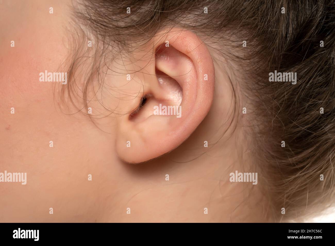 Close up shot of a female ear with ear ring hole Stock Photo - Alamy