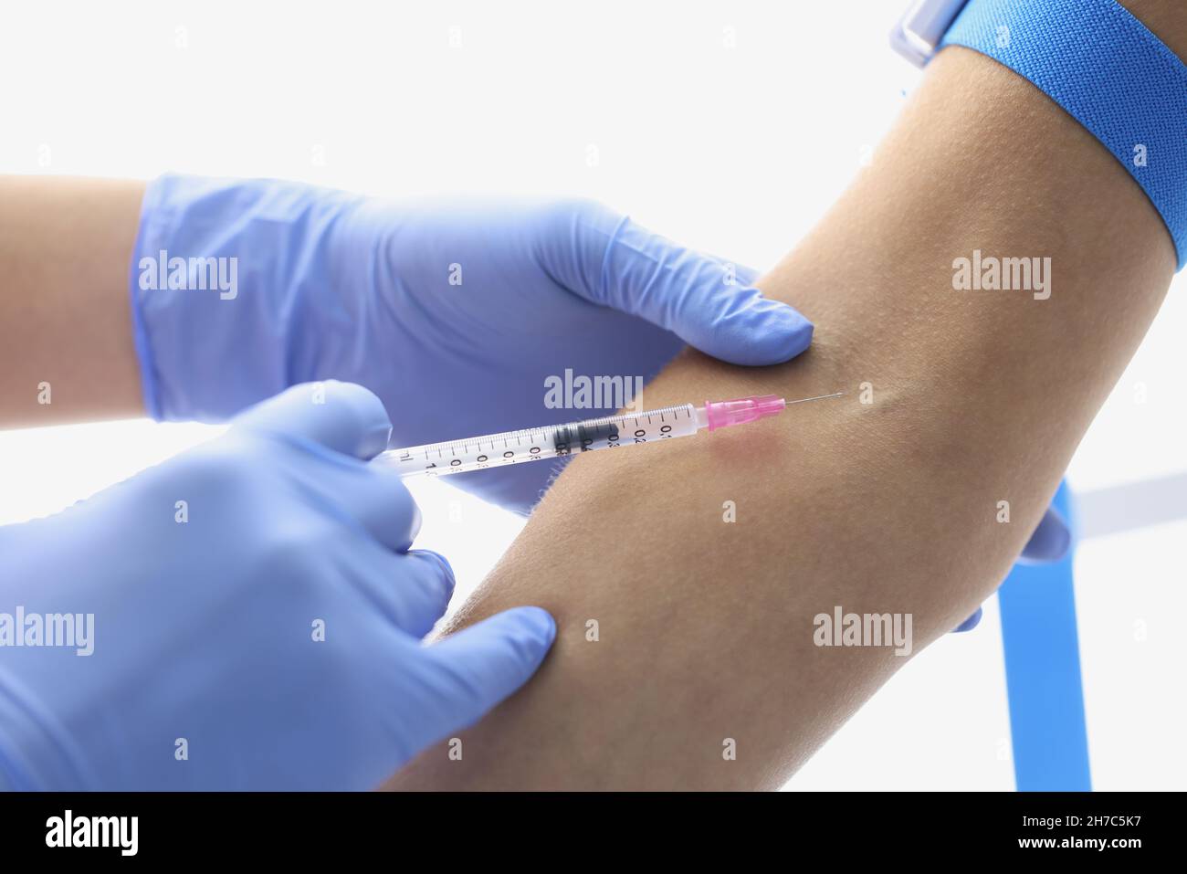 Nurse injects liquid medication in patients vein with needle Stock ...