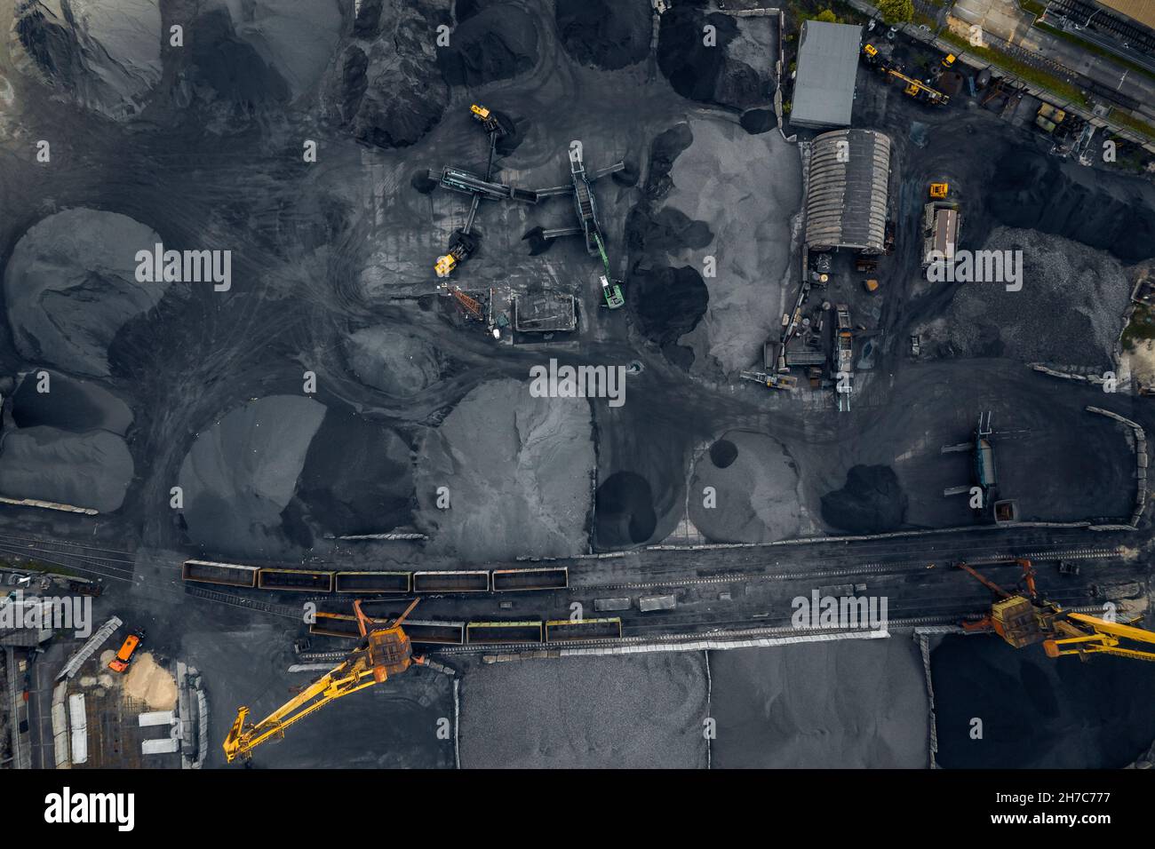 Loading and unloading coal on ship terminal sea cargo port, industrial ...