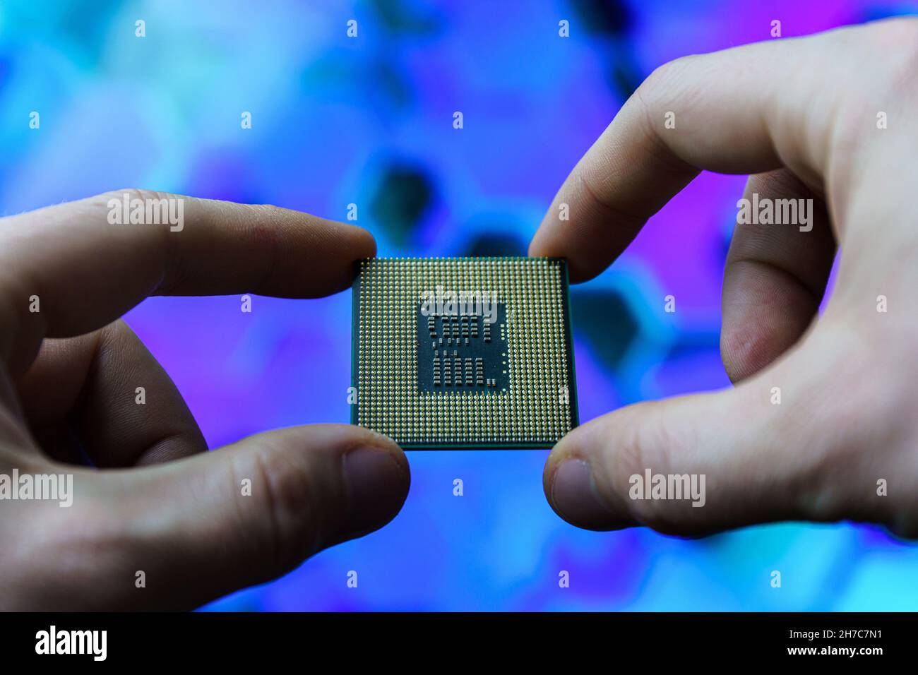 Computer chip in hands. A chipset is a set of electronic component that ...